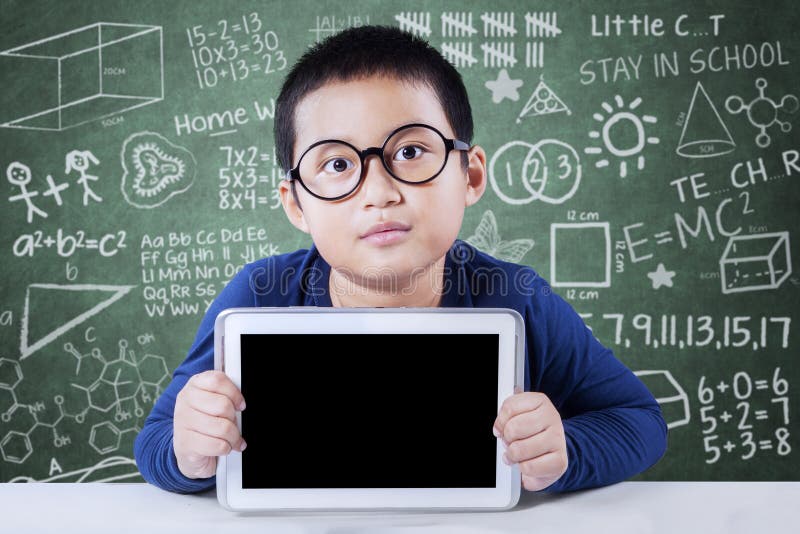Cute Boy Shows Tablet Screen in the Class Stock Photo - Image of ...