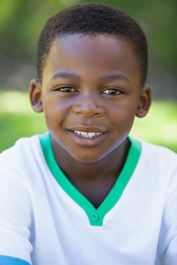 Cute Boy Smiling at the Camera in the Park Stock Image - Image of ...