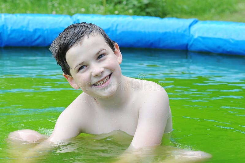 Cute Boy Smiling and Sitting in a Pool Stock Image - Image of kids ...
