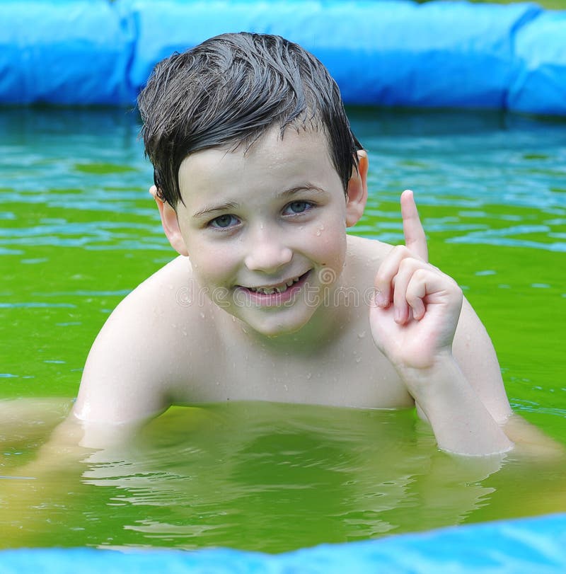 Cute Boy Smiling and Sitting in a Pool Stock Image - Image of kids ...