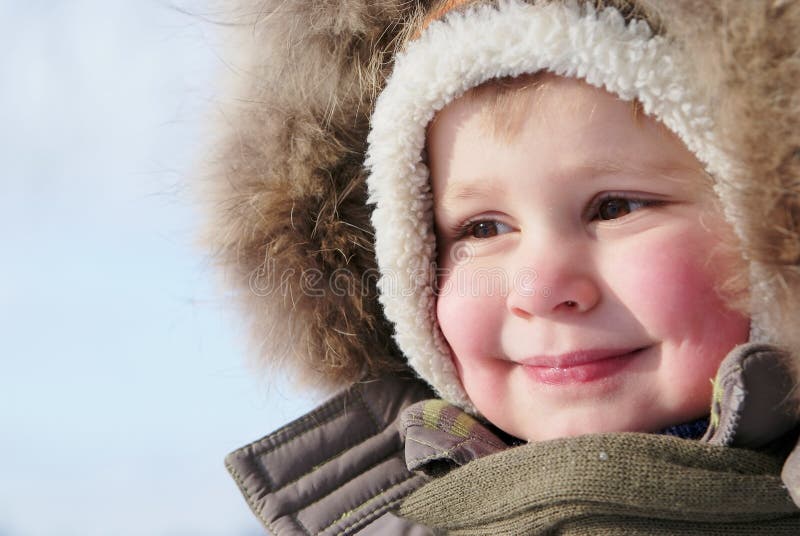 Cute boy in snowsuit stock image. Image of outside, playing - 15602819