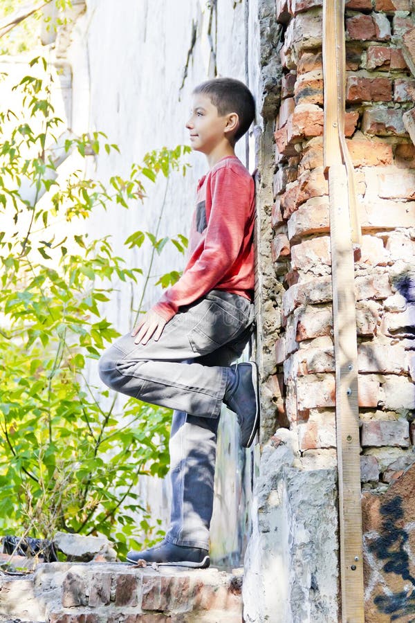 Cute Boy Standing Near Old Brick Wall Stock Image - Image of nine, baby ...