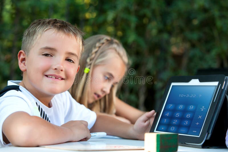 Boy Showing Homework on Tablet Outdoors. Stock Photo - Image of ...