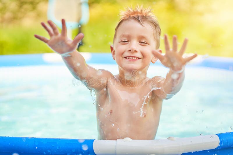 Cute Boy Swimming and Playing in a Backyard Pool Stock Image - Image of ...