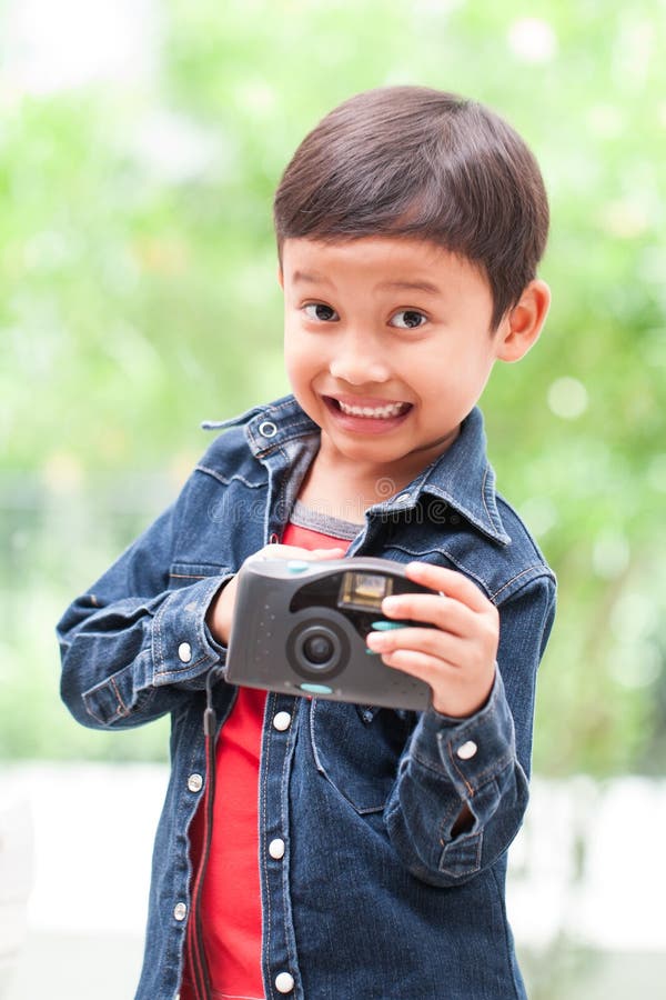 Cute Boy Using Compact Camera. Stock Photo - Image of child, people ...