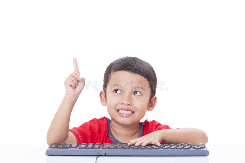 Cute Boy using a keyboard stock photo. Image of fingers - 45643150