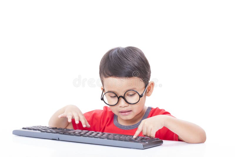 Cute Boy using a keyboard stock photo. Image of fingers - 45643150