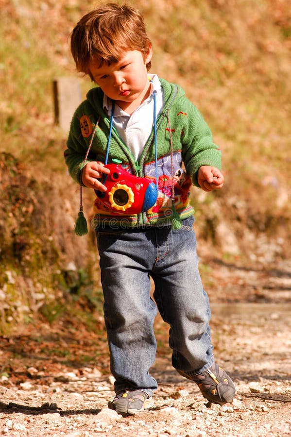 Cute Boy Walking with a Camera Stock Image - Image of curious, cute ...