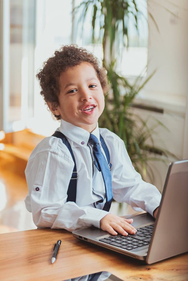 Cute Boy Working on a Laptop Stock Image - Image of notebook ...