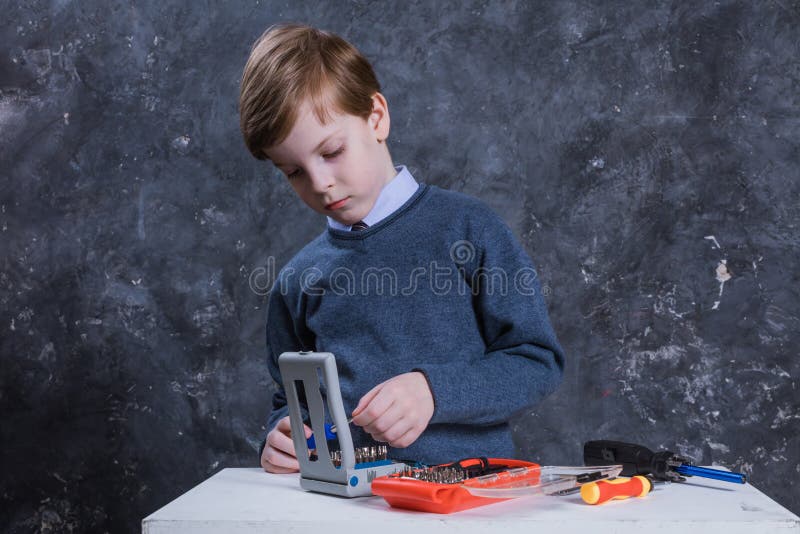 Cute Boy with Working Tools Studio Portrait. Stock Image - Image of ...