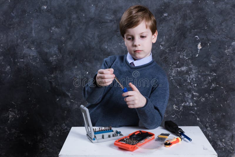 Cute Boy with Working Tools Studio Portrait. Stock Image - Image of ...
