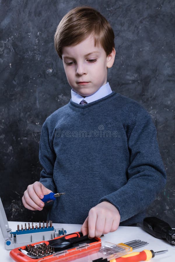 Cute Boy with Working Tools Studio Portrait. Stock Image - Image of ...