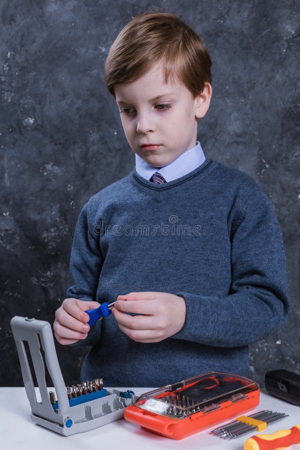 Cute Boy with Working Tools Studio Portrait. Stock Image - Image of ...