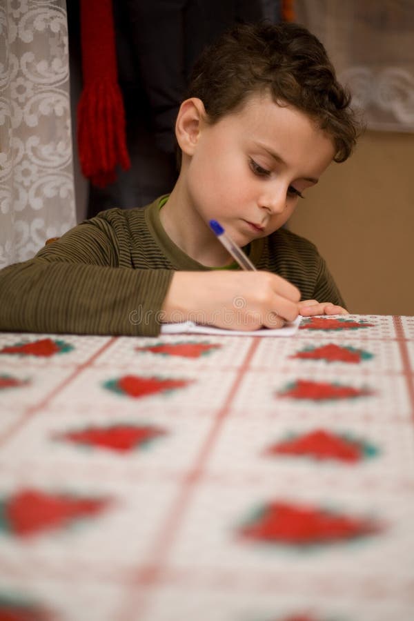 Cute Boy Writing in a Notebook Stock Image - Image of home, beautiful ...