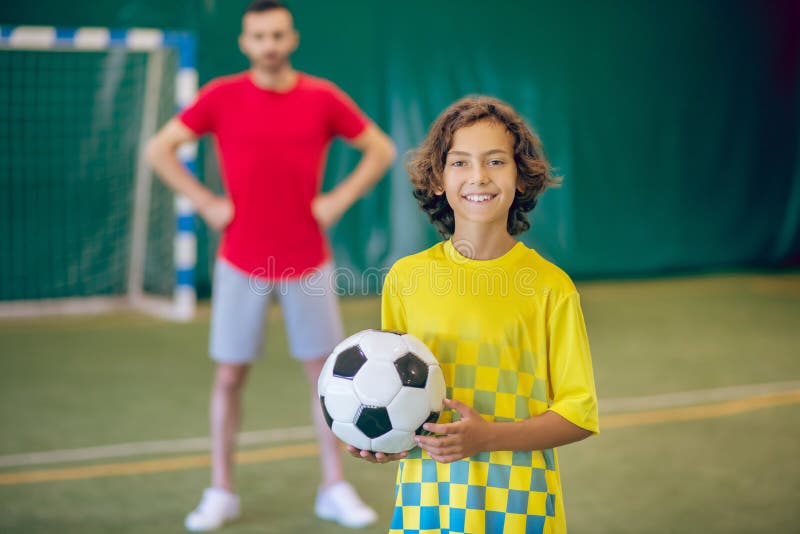 Cute Boy in Yellow Uniform Feeling Good at PE Lesson Stock Image ...