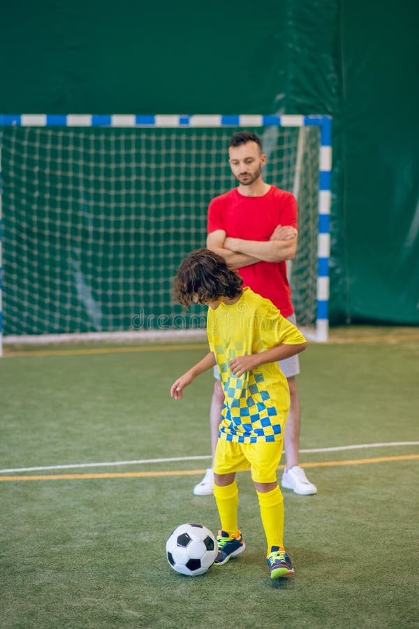 Cute Boy in Yellow Uniform Feeling Good at PE Lesson Stock Image ...