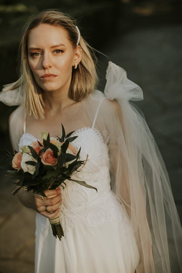 Cute Bride with Flower Bouquet Stock Photo - Image of smile, portrait ...