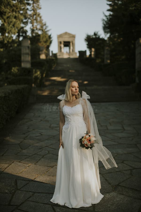 Cute Bride with Flower Bouquet Stock Photo - Image of caucasian, alone ...