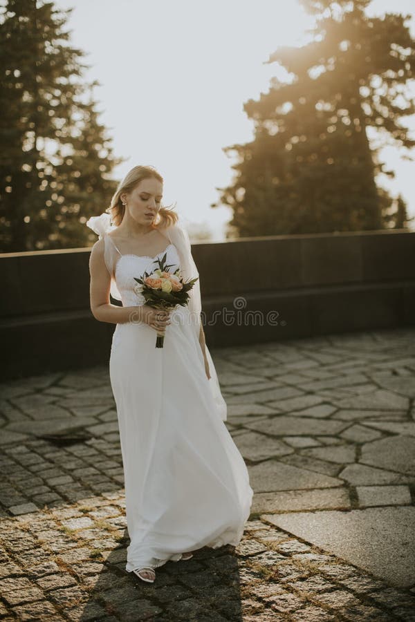 Cute Bride with Flower Bouquet Stock Photo - Image of face, closeup ...