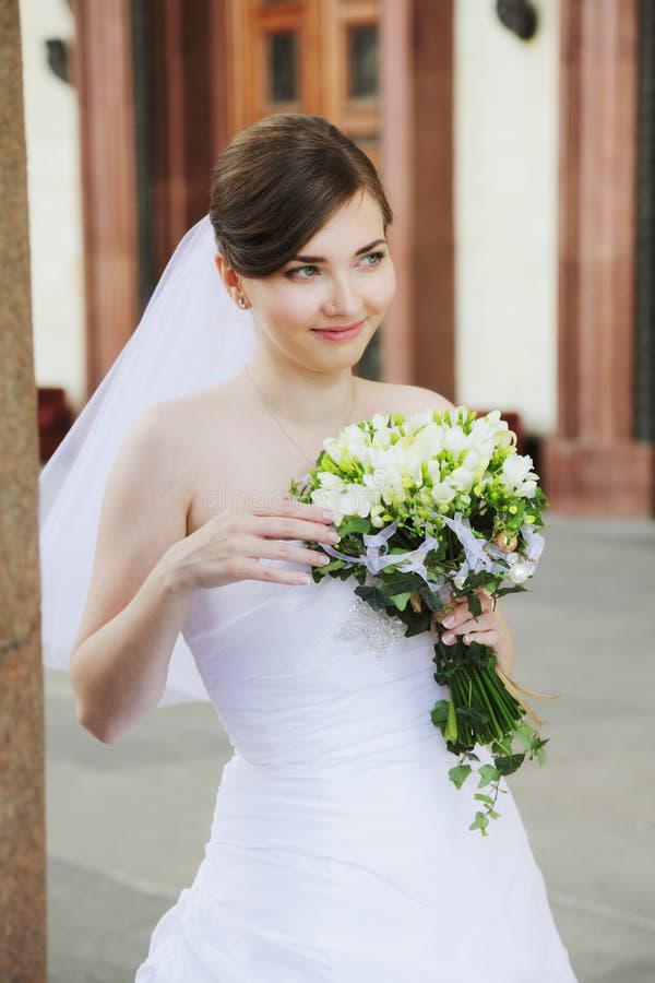 Cute Bride with Flower Bouquet Stock Photo - Image of wedding, flowers ...