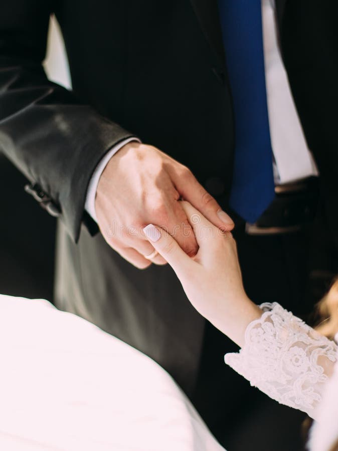 Cute Bride and Groom Holding Hands with Wedding Rings on Stock Image ...