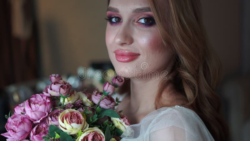 Cute Bride Posing with a Bouquet of Flowers. Stock Video - Video of ...