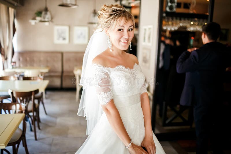 Cute Bride in a Wedding Dress at Cafe Stock Photo - Image of beautiful ...