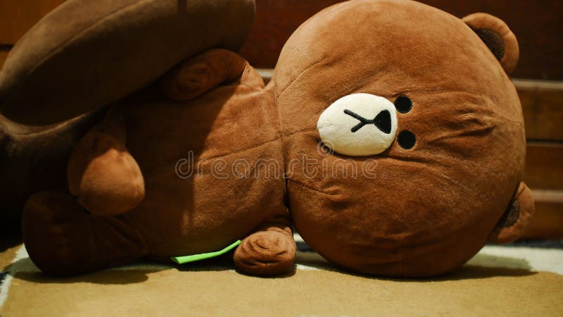 Brown Doll Lying on the Carpet Stock Image - Image of cute, wall: 273445241