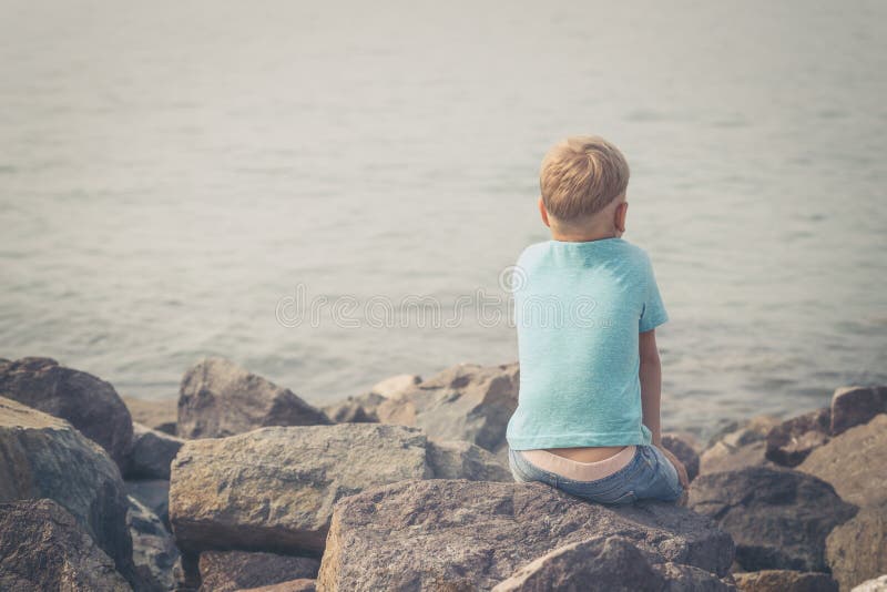Cute Caucasian Boy at Seaside Stock Photo - Image of coast, activity ...