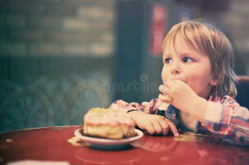 Cute Cheerful Blond Boy Sitting in Cafe with Piece of Cake Stock Image ...