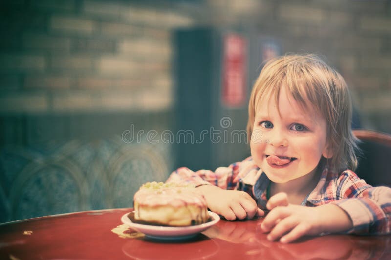 Cute Cheerful Blond Boy Sitting in Cafe with Piece of Cake Stock Image ...