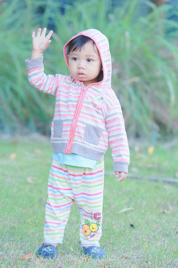 Cute cheerful kids stock photo. Image of grass, background - 76933200