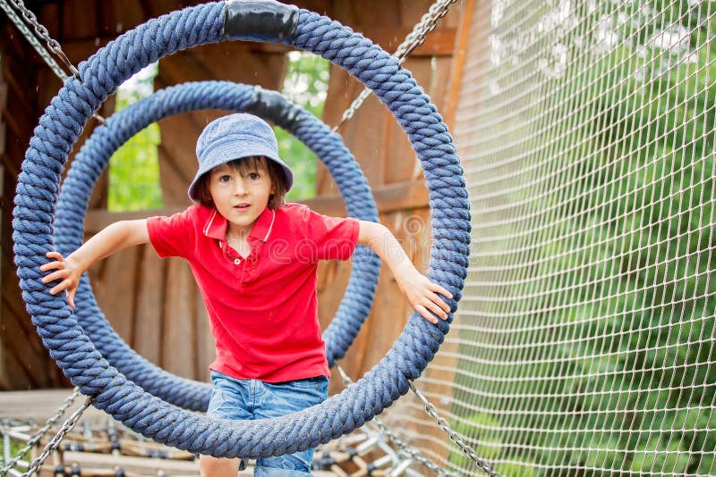 Cute Child, Boy, Climbing in a Rope Playground Structure Stock Photo ... Cute Child, Boy, Climbing in a Rope Playground Structure Stock Photo ...