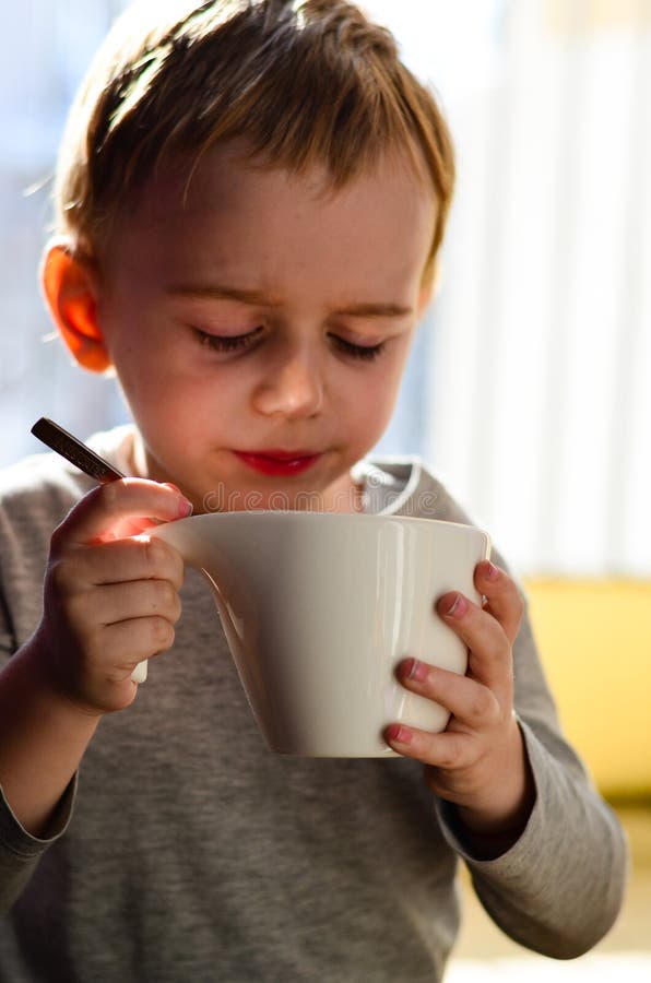 Cute child drinking tea stock photo. Image of elements - 65308472