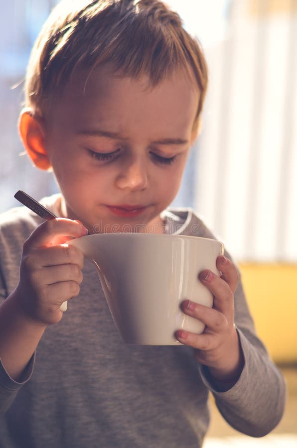 Cute child drinking tea stock photo. Image of elements - 65308472