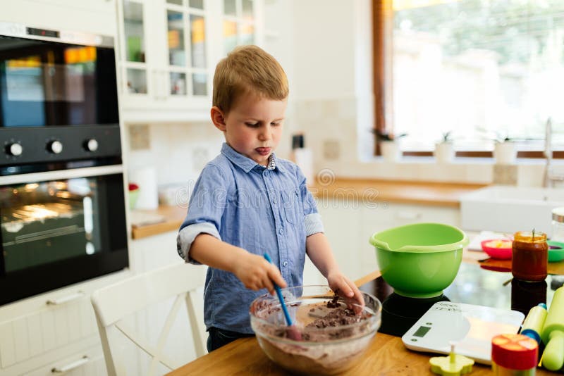 Cute Child Learning To Become a Chef Stock Photo - Image of enjoyment ...