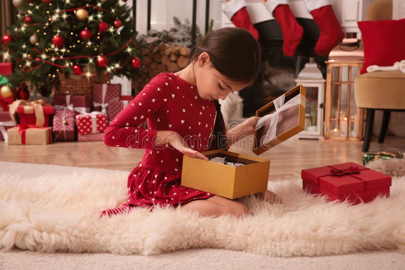 Cute Child Opening Christmas Gift on Floor at Home Stock Image - Image ...