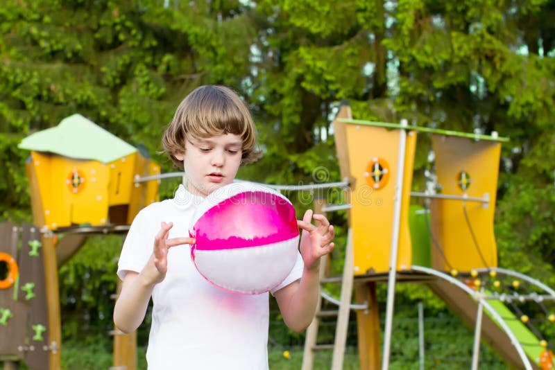 Cute Child with Pink Ball on Colorful Playground Stock Image - Image of ...