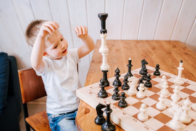 Child Playing Chess at Home at the Table Stock Photo - Image of game ...