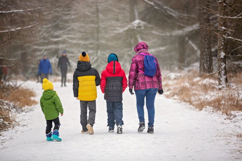 Cute Child, Playing in Winter Forest on a Cold Winter Day Stock Photo ...