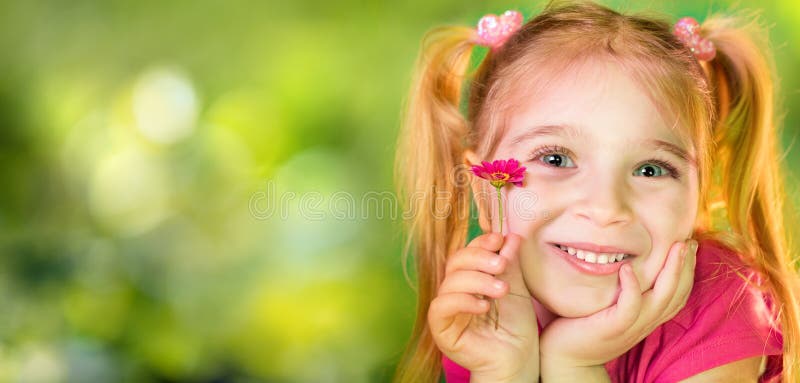 Cute Child with Purple Daisy Stock Photo - Image of little, lawn: 70840970