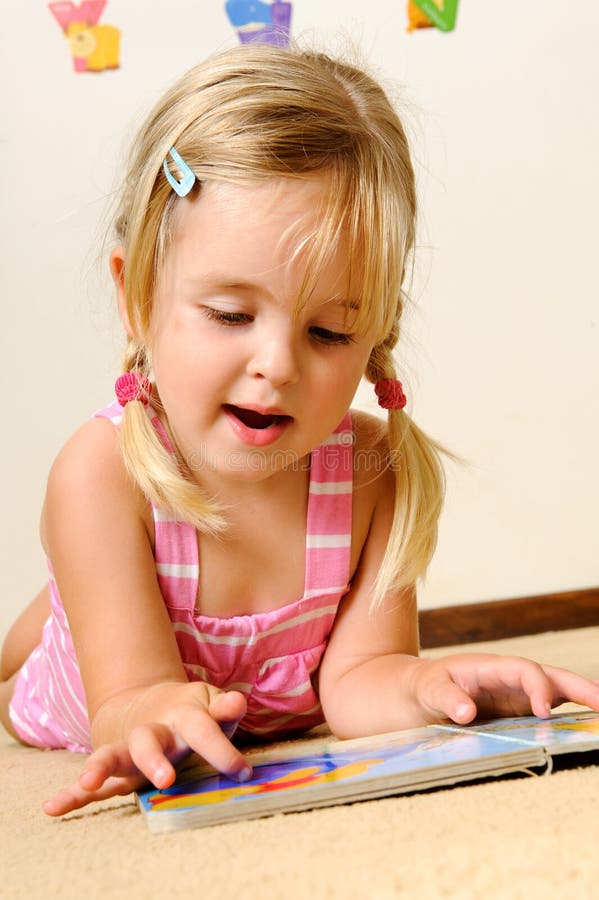 Cute child reading stock image. Image of floor, intelligent - 18402373