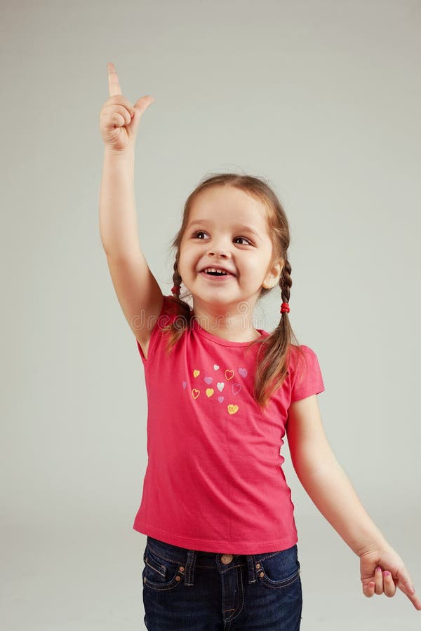 Cute Child Smiling and Pointing Up. Stock Photo - Image of happiness ...