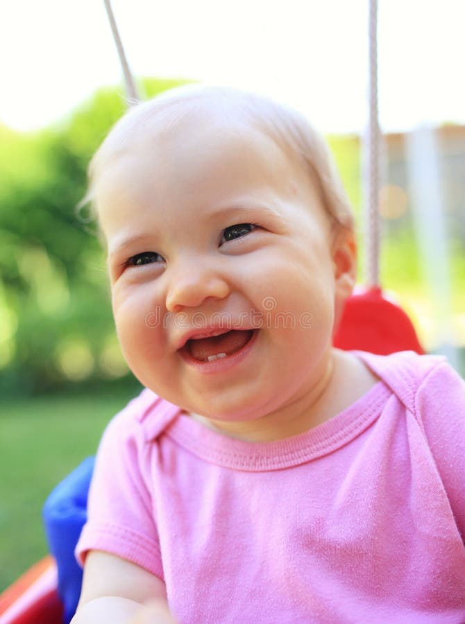 Cute Child Smiling in Swing Stock Photo - Image of beautiful, park ...