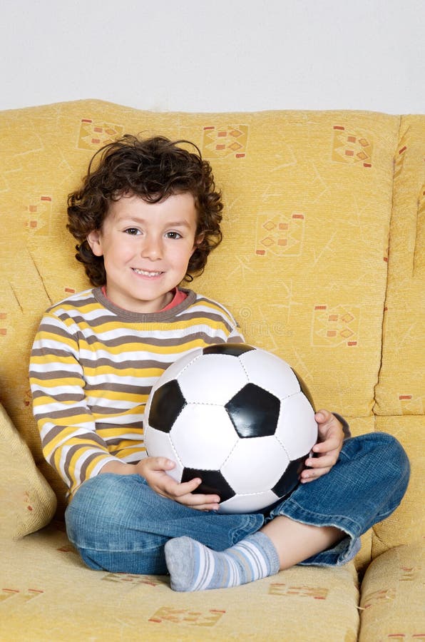 Cute Child with a Soccer Ball on the Sofa Stock Image - Image of child ...