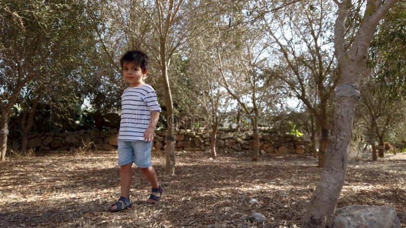 Cute Child Boy in Suit Biting on the Coin. Child Savings and Growth of ...