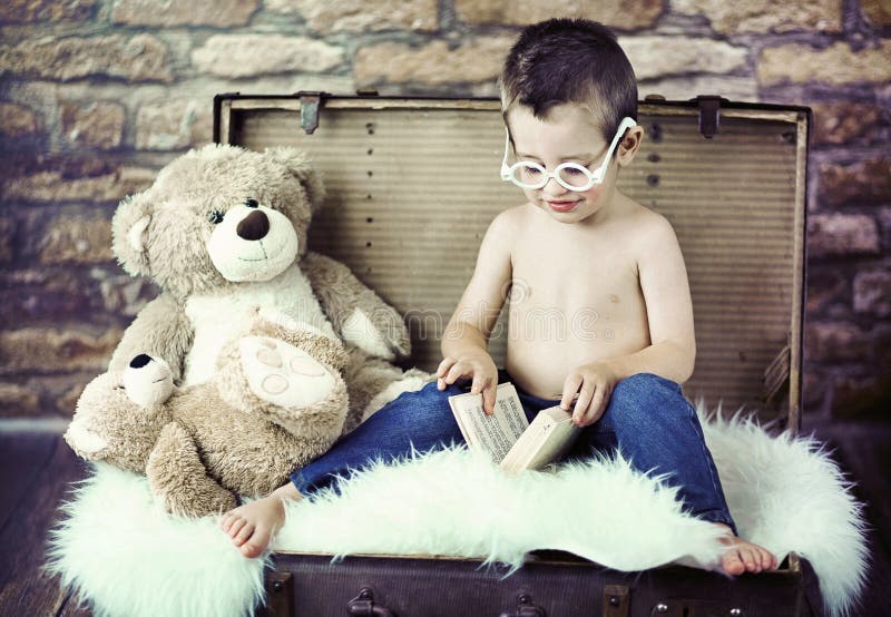 Cute child trying to read stock photo. Image of happy - 28860978
