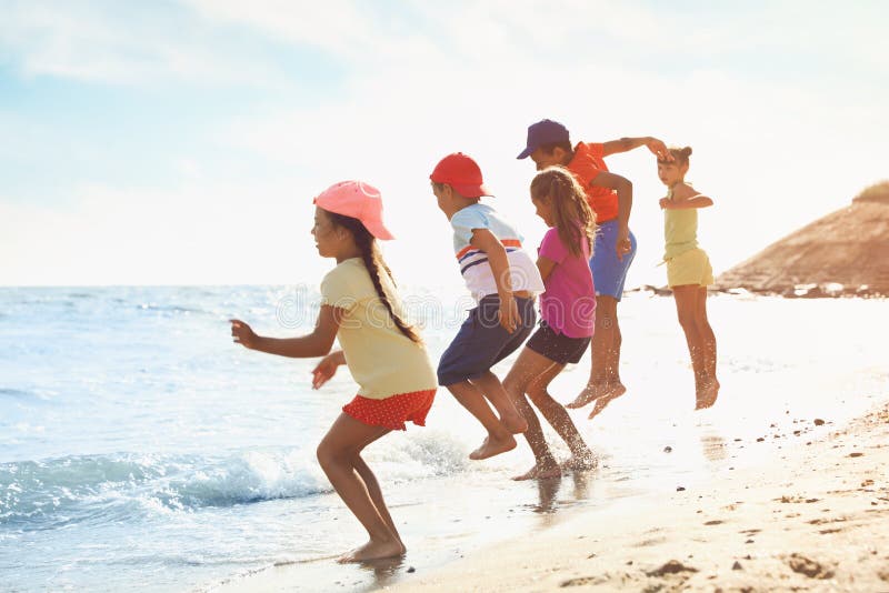 Cute Children Enjoying Sunny Day at Beach. Summer Camp Stock Photo ...