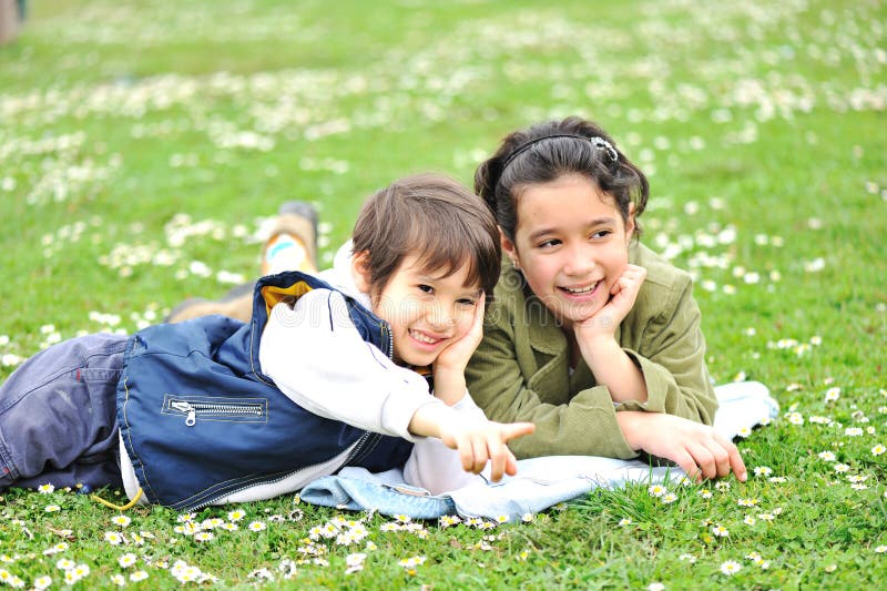 Cute children on meadow stock photo. Image of laugh, outdoor - 13978164