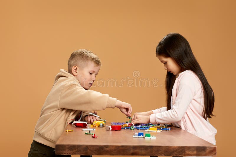 Cute Children Playing with Electronic Constructor at Studio Stock Photo ...